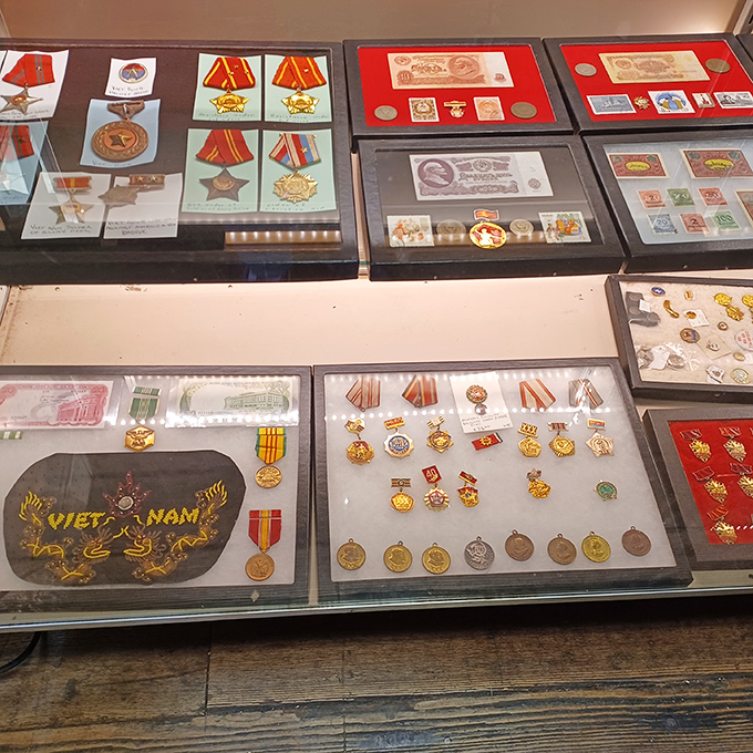 Military medals and historic currency that remind us every object has a story, each display case a chapter of American history.