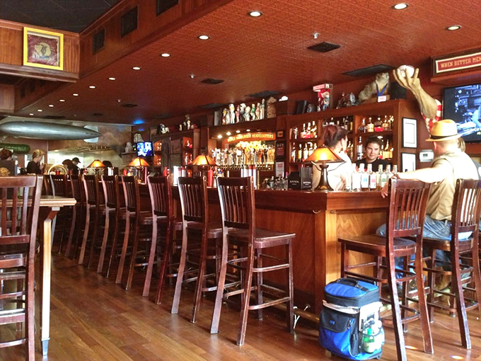 The bar's warm glow invites you to pull up a stool and stay awhile&mdash;because burger pilgrimages deserve proper hydration. 