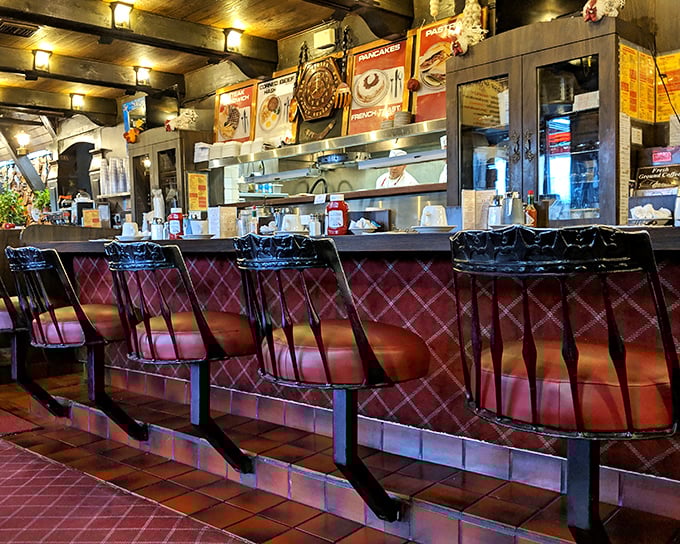 The counter seating offers front-row tickets to the breakfast show. Watch the short-order magic happen while perched on those classic burgundy stools.