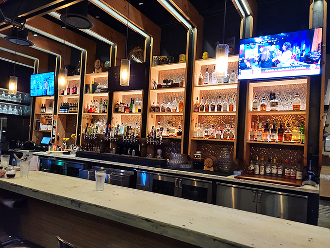 A bar stocked like my fantasy kitchen. The copper accents and warm lighting create the perfect backdrop for decision-making of the liquid variety.