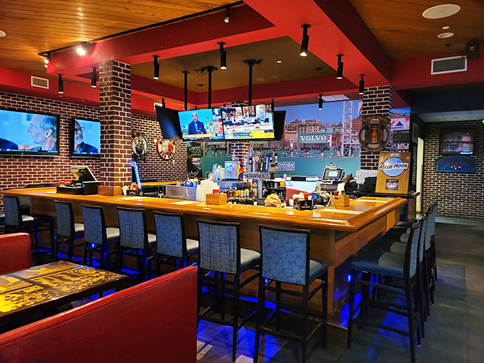 A bar area that perfectly balances sports shrine with coastal hangout. The wooden bar practically tells stories of championship celebrations and heartbreaking defeats.