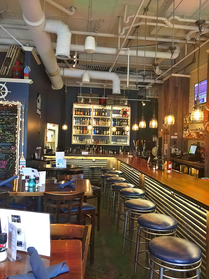 The bar area strikes that perfect balance between "I'm somewhere special" and "I feel right at home"&mdash;with illuminated bottles promising liquid adventures.