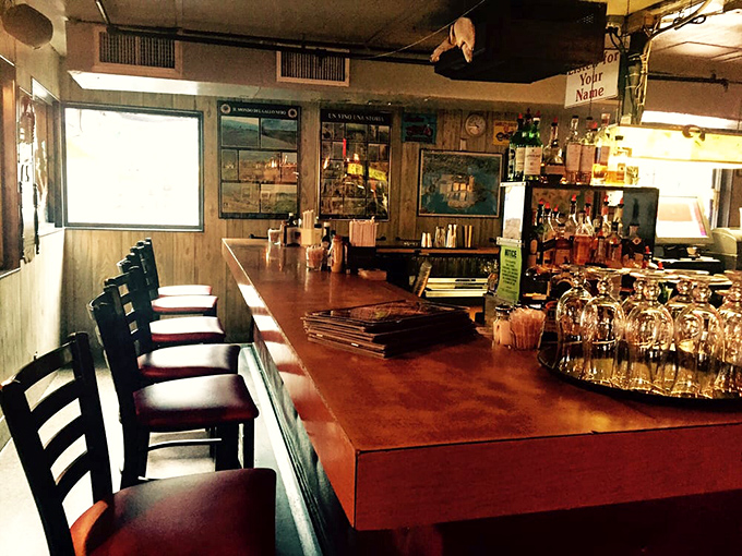 The bar area – where seafood stories get better with each round. Wood-paneled walls have heard it all, from "the one that got away" to "another round, please."