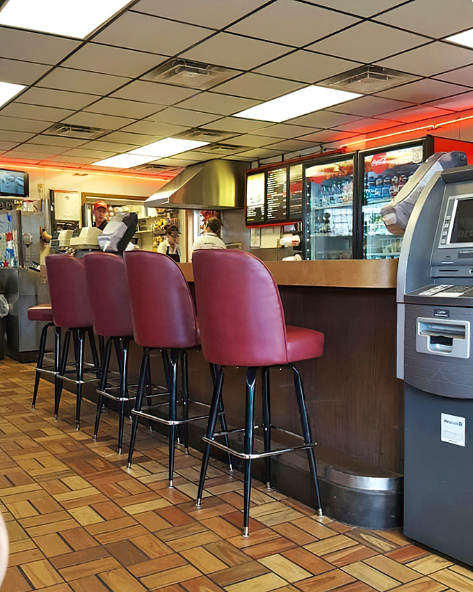 The counter seats &ndash; where regulars perch like birds on a wire, exchanging local gossip while watching sandwich magic unfold.