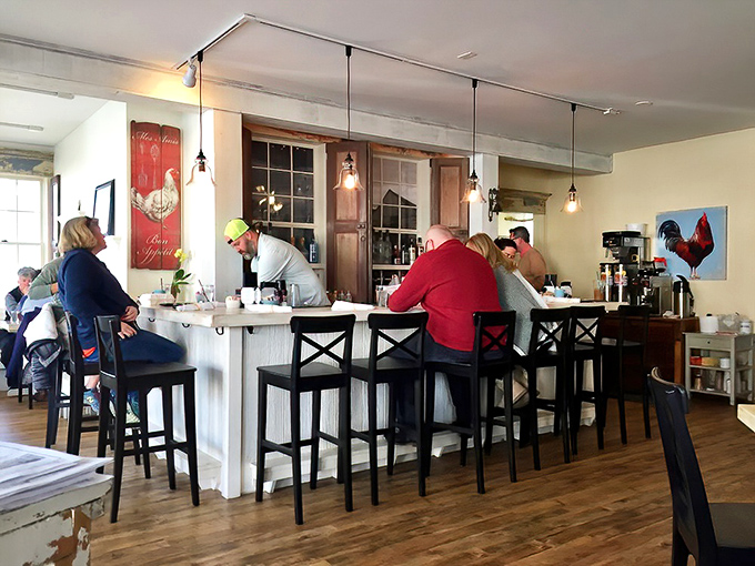 The counter seating offers front-row tickets to the breakfast show. Watch the culinary choreography while sipping that essential morning coffee.