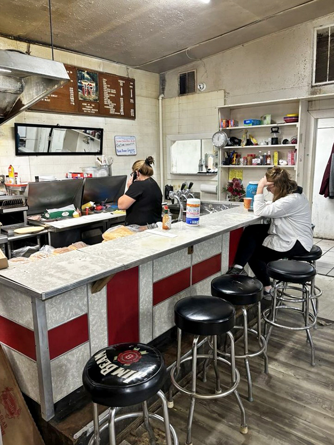 The counter seating offers front-row tickets to the burger show. Grab a stool and watch culinary history unfold just inches from your hungry eyes.