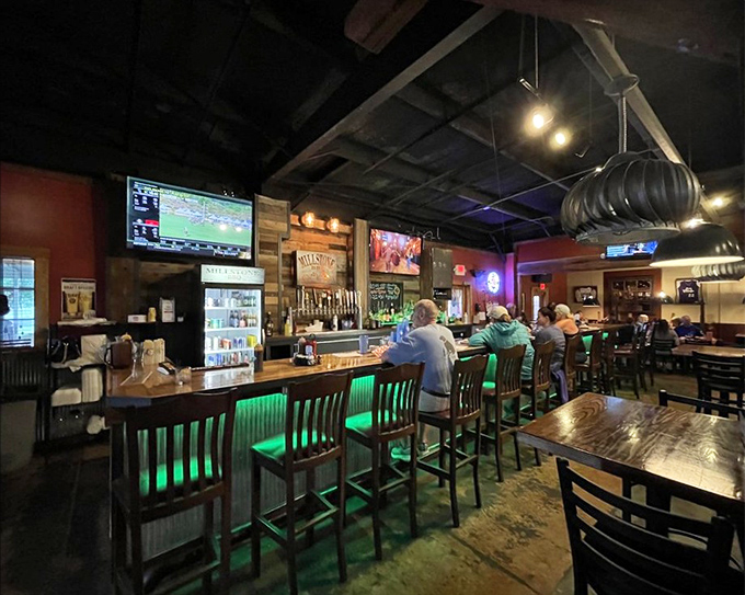 The bar area: where BBQ enthusiasts gather to debate sauce preferences and celebrate the universal language of smoked meat. 