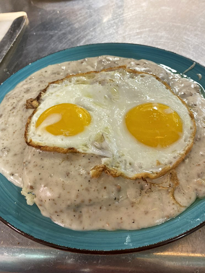 Biscuits and gravy with sunny-side-up eggs&mdash;the breakfast equivalent of a warm hug from your favorite aunt who can actually cook.