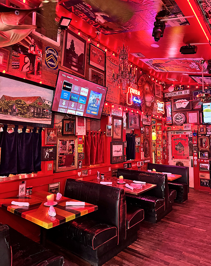 The dining room glows with that signature red light, making everyone look like they're having the time of their lives &ndash; because they probably are.