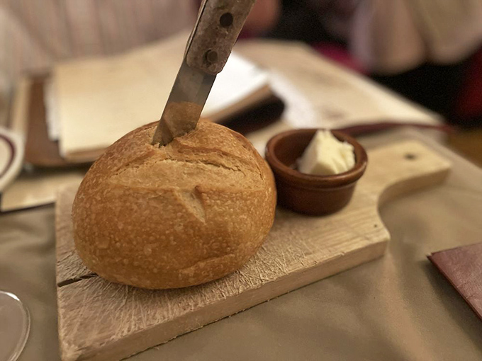 The bread arrives warm and crusty, with a side of butter that melts on contact &ndash; a simple pleasure that sets the tone for the feast to come.