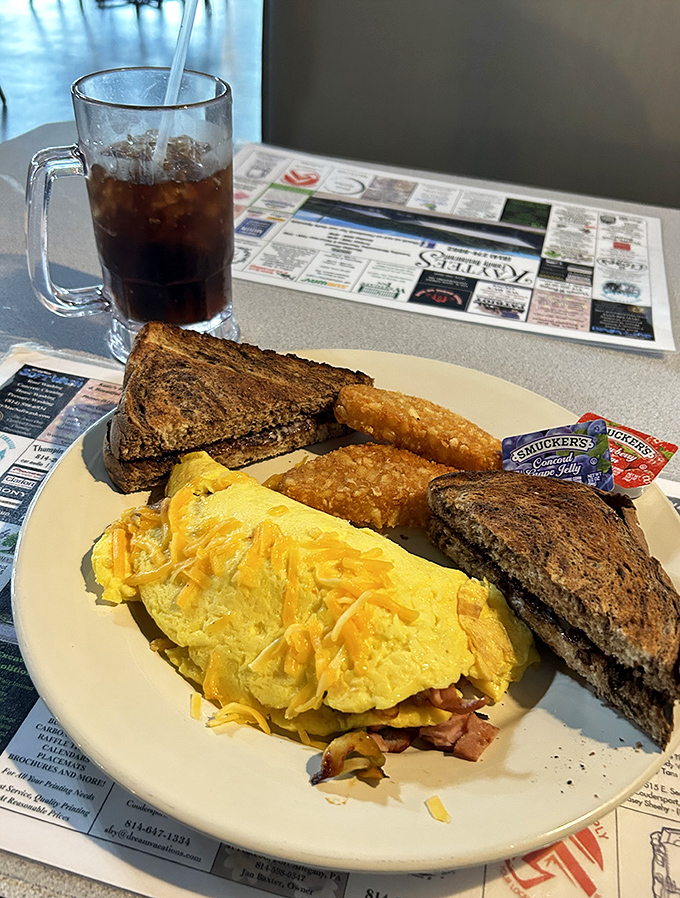 A breakfast trinity: perfectly scrambled eggs, toast with character, and hash browns that didn't come from a freezer bag.