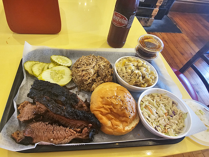 A tray that answers life's most important question: "Why choose one meat when you can have them all?" The cornbread is just the bonus round.