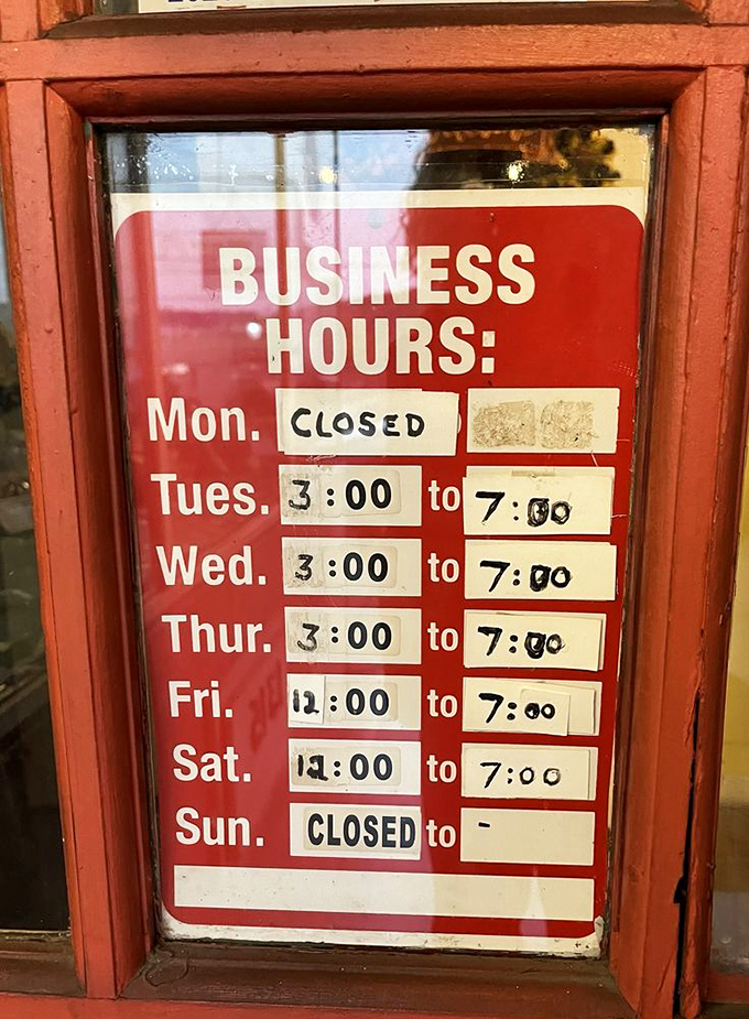 Hours posted with handwritten precision&mdash;a sign of a place that does things the old-school way, including their transcendent chicken recipe.