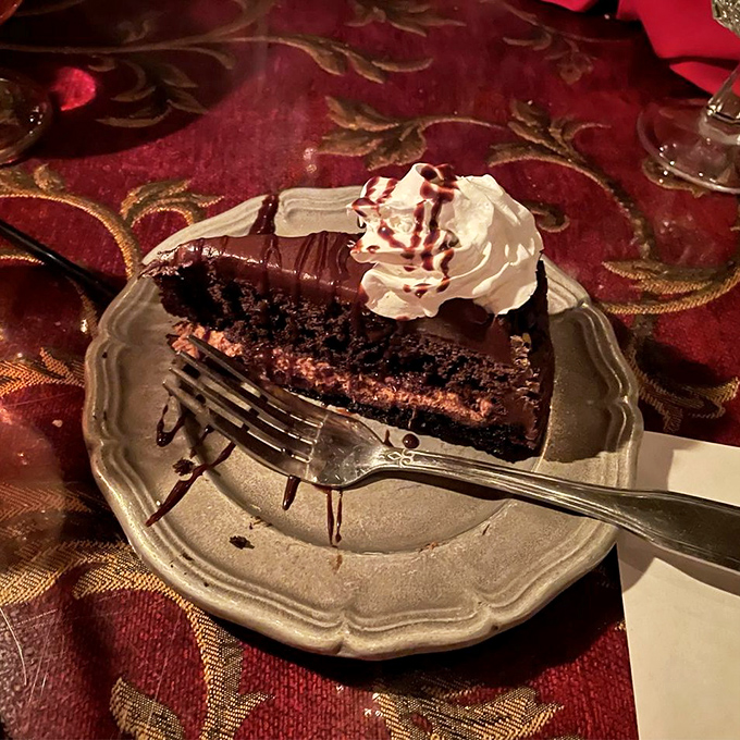 A chocolate cake so decadent it should come with a warning label. That whipped cream and drizzle are just showing off at this point.