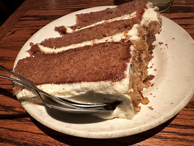 A slice of carrot cake that could double as apartment real estate in Manhattan. Those layers are telling a delicious story.