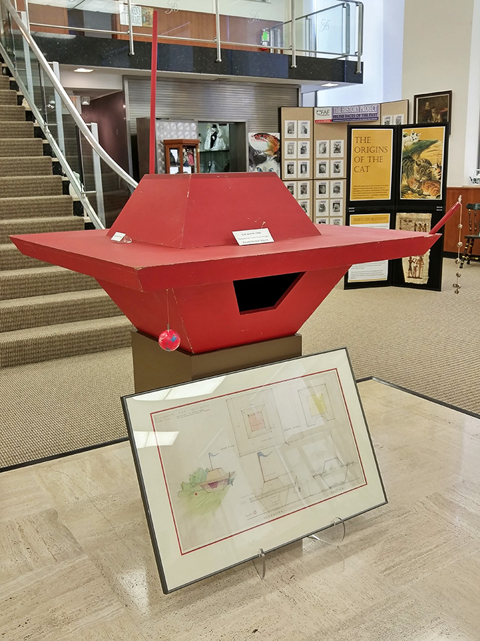 This striking red cat house design looks like something Frank Lloyd Wright might have created if his clients had whiskers and a penchant for napping.