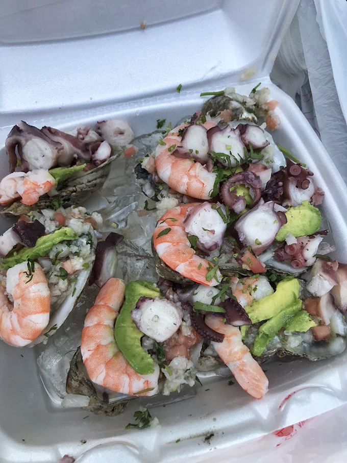 Cup o' happiness! This seafood cocktail combines tender morsels of ocean treasures in a bright, tangy sauce that demands to be savored.