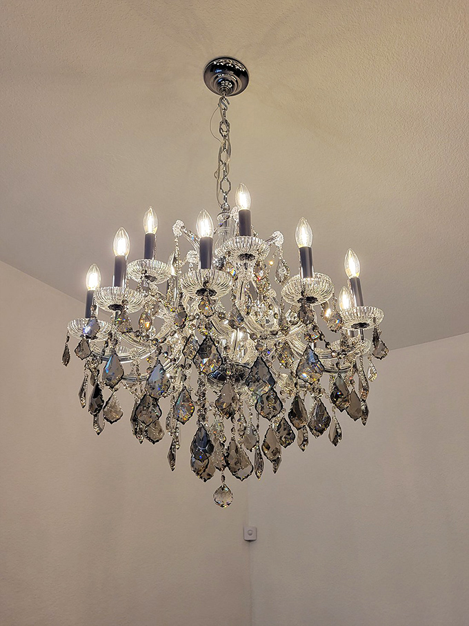Not your builder-grade lighting fixture! This crystal chandelier has enough sparkle to make even the most modest dining room feel like Versailles.