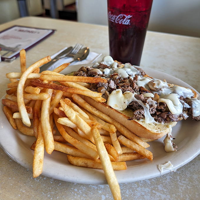 The open-faced cheese steak sandwich doesn't just satisfy hunger&mdash;it obliterates it, with a side of fries that could stand alone as a meal.