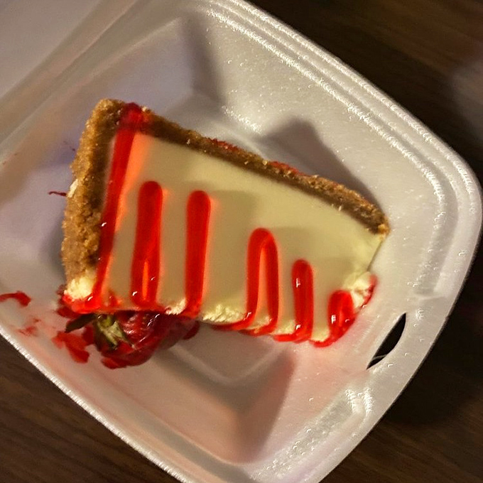 Cheesecake slices strut the fine line between dessert and art, with strawberry drizzle that's both accessory and necessity.
