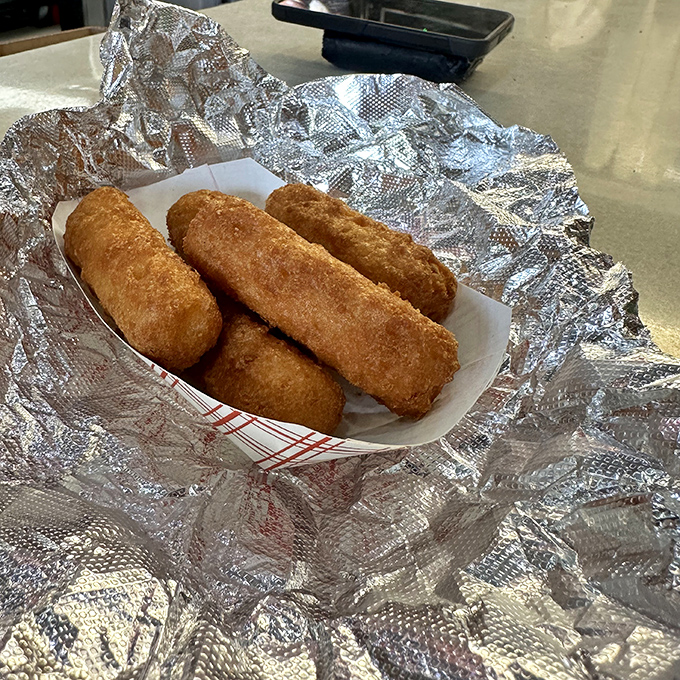 Golden, crispy cheese sticks that make mozzarella sticks elsewhere seem like mere practice runs. The perfect savory counterpoint to sweet donut indulgence.