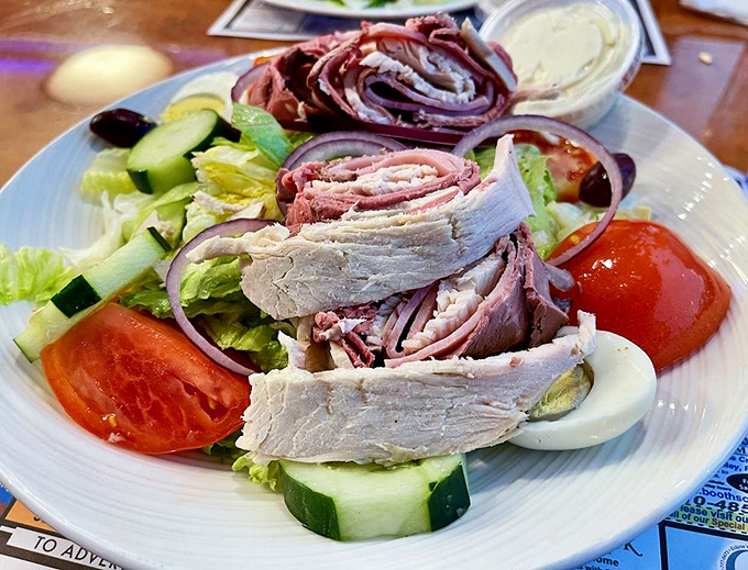 A chef's salad so perfectly arranged it looks like it graduated from design school before landing on your table.