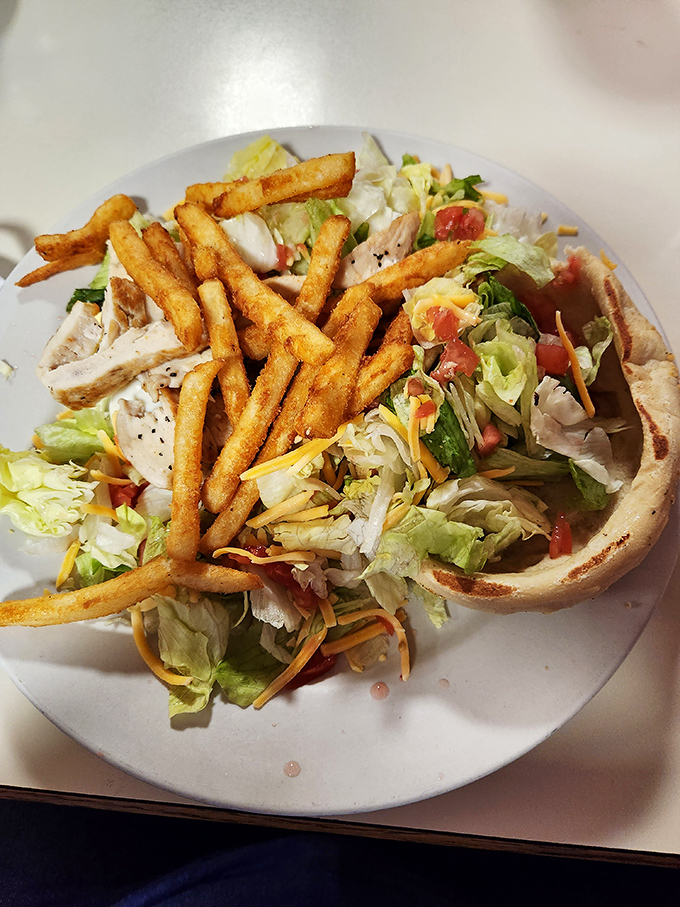 Fresh, crispy fries alongside a salad that proves healthy eating doesn't have to be punishment. Balance in all things, especially lunch.