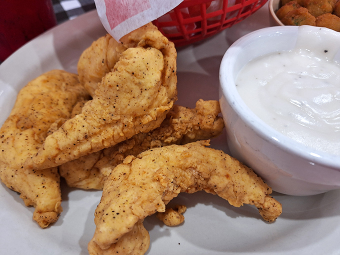 Chicken tenders that actually deserve the name "tender." Crispy on the outside, juicy on the inside, and served with a side of nostalgia.