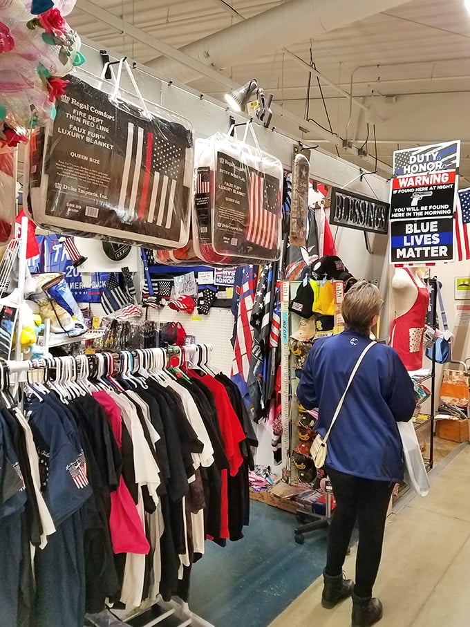 Patriotism meets practicality in this clothing booth. Where else can you find both a cozy blanket and your Second Amendment rights?