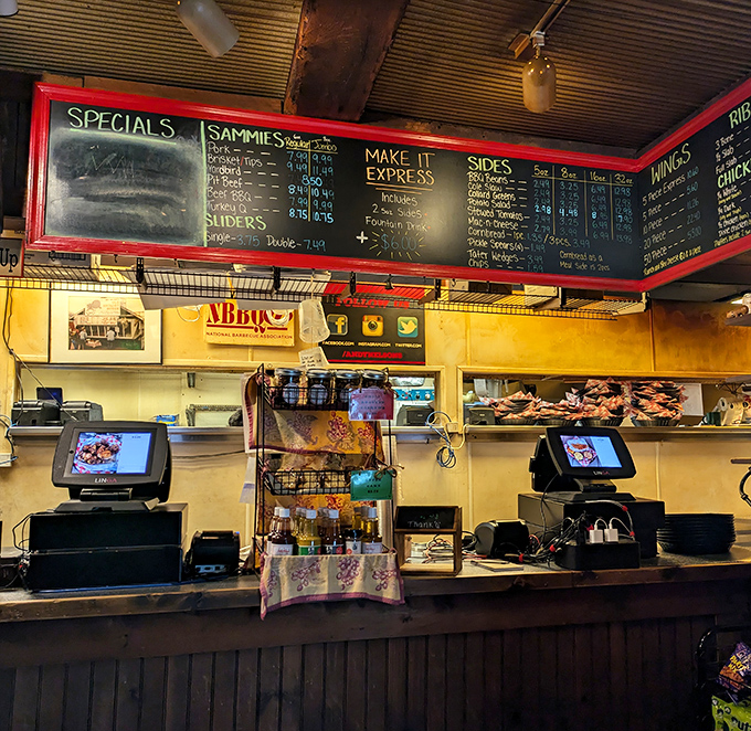 Where barbecue dreams come true &ndash; the ordering counter with its handwritten specials board promises smoky treasures just moments away.