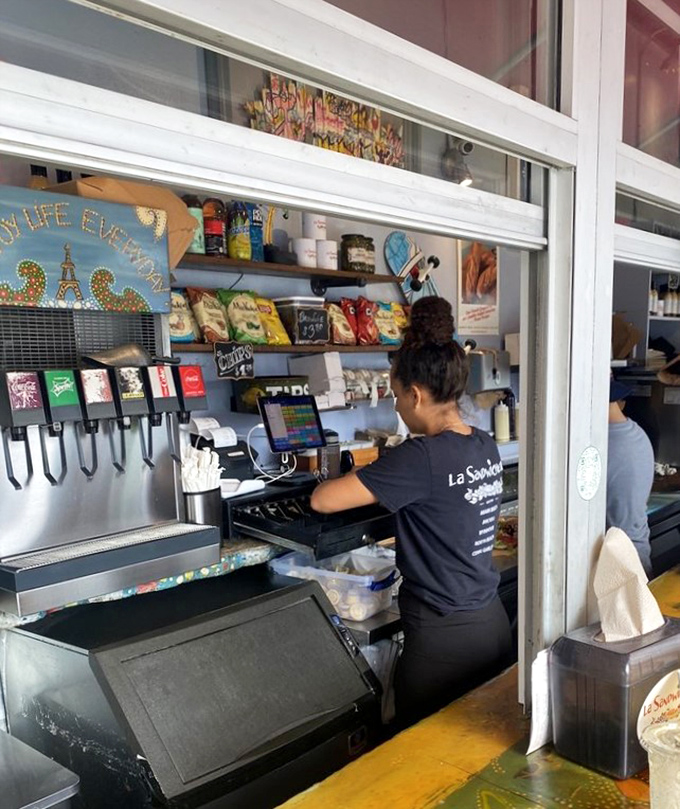 The counter where dreams come true, one sandwich at a time. Staff working with the precision of surgeons and the creativity of artists.