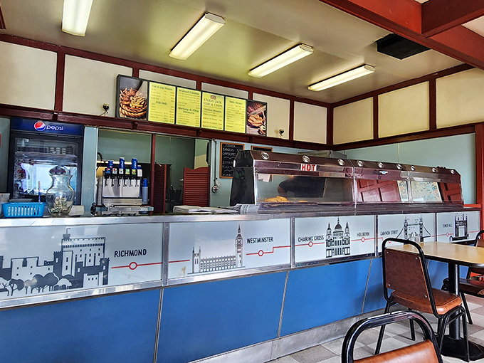 The counter where magic happens&mdash;a London Underground map guides you through British culinary stations. The hot lamps keep the treasures warm until they reach your table.