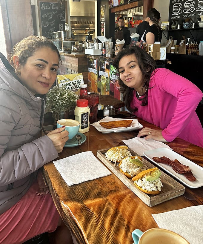 The universal language of friendship: sharing good food while plotting which dessert you'll "split" but secretly want all to yourself.