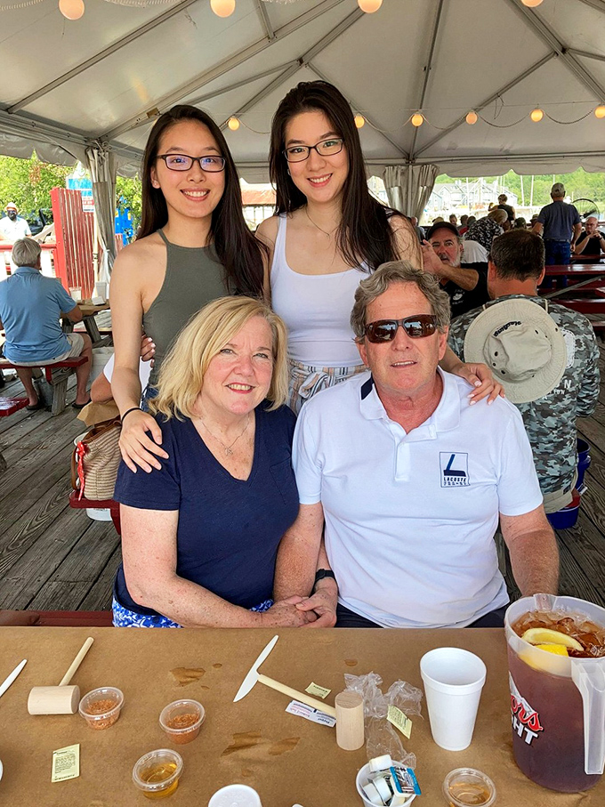 Multi-generational dining at its finest, where grandparents and grandkids bond over shared plates of steamed crabs.