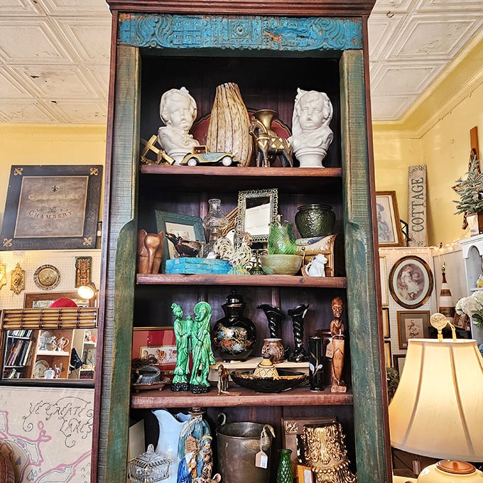 This antique cabinet doesn't just display collectibles&mdash;it showcases the artistry of a bygone era when craftsmanship meant something and turquoise was always in style.