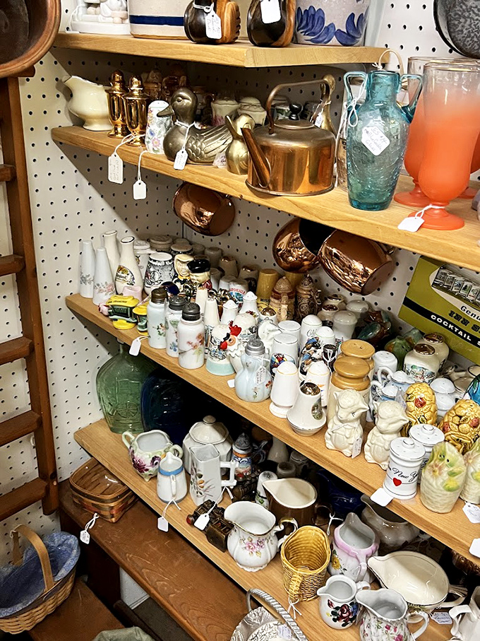 Ceramic heaven for the discerning collector. Those teapots, salt and pepper shakers, and delicate figurines survived decades to find their place on these pegboard walls.