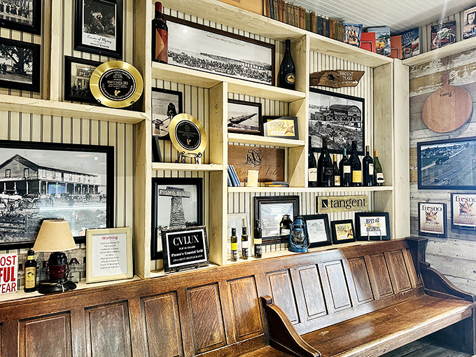 The wall of coastal memorabilia creates a shrine to California beach culture. It's like someone's cool grandpa designed a seaside museum.
