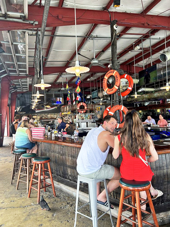 The bar scene: where locals and tourists blend as smoothly as the rum in your mojito.