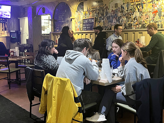 The true measure of a great eatery: happy people sharing food and conversation. Notice how nobody's looking at their phones? That's culinary magic at work.