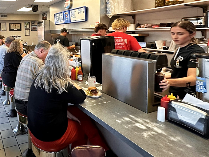 The counter at Gordon's isn't just where food appears—it's where community happens, one burger conversation at a time.