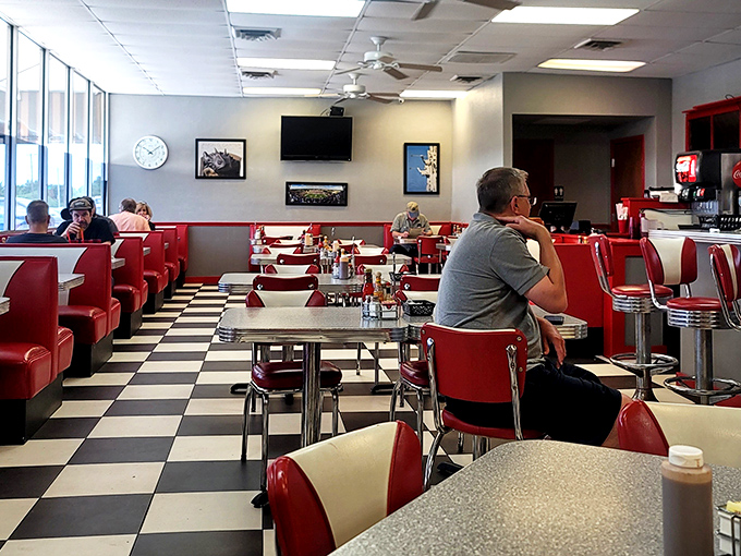 The dining room hums with the satisfied murmurs of locals who know they've made the right breakfast decision. Strangers united by good taste.