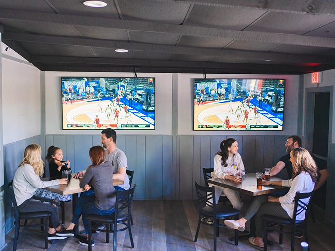 Where strangers become friends and friends become family. The communal joy of good food and cold drinks plays out under the glow of basketball games.
