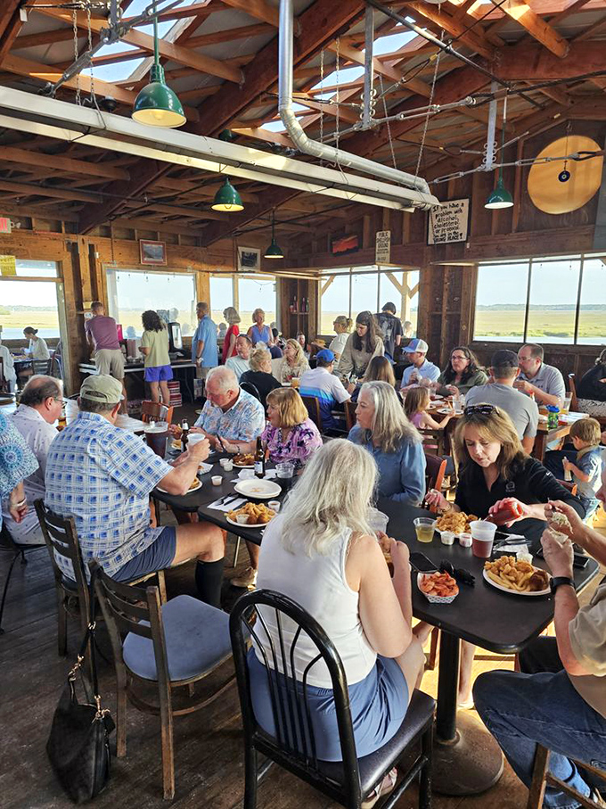 The dining room buzzes with the happy chatter of patrons who've discovered that great seafood tastes even better with a side of marsh views.