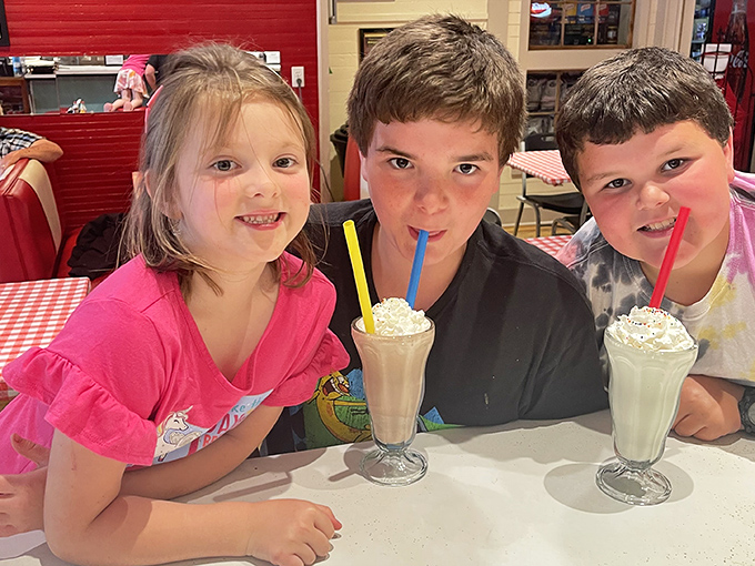 Milkshakes bringing smiles to young faces&mdash;proof that some joys transcend generations. These kids understand what happiness tastes like. 