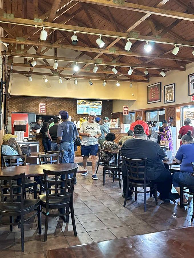 Local diners gather like family around tables, sharing stories and savoring barbecue that brings communities together naturally.