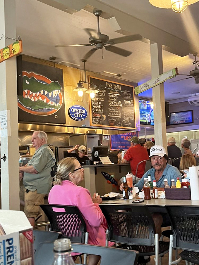 Locals and visitors alike gather at simple tables, united by the universal language of exceptional seafood and cold drinks.