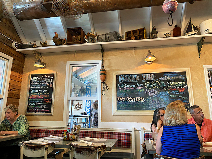The dining room feels like a fisherman's cabin that accidentally became the hottest reservation in town. Nautical chic meets Southern comfort.