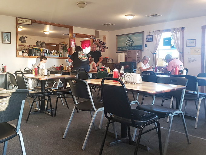 The bustling dining room where strangers become friends, united by their mutual devotion to perfectly fried seafood.