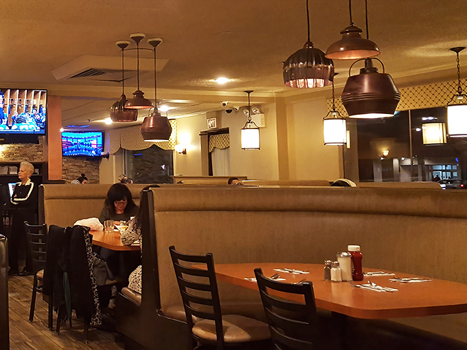 High-backed booths create those perfect little islands of privacy, where coffee conversations and pancake revelations happen without interruption.