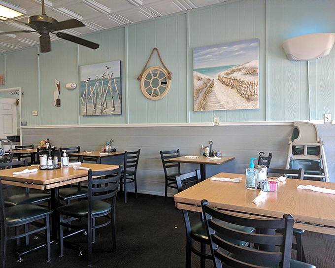 Coastal artwork and aqua walls create that "yes, you're on vacation" vibe, even if you're just stopping in before heading to work.